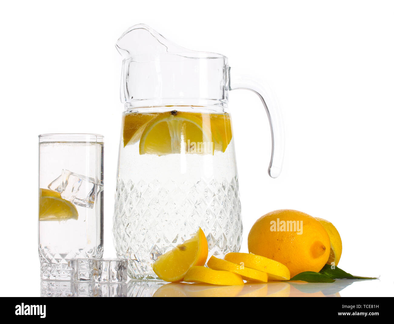 pitcher and glass of lemonade and lemon isolated on white Stock Photo ...
