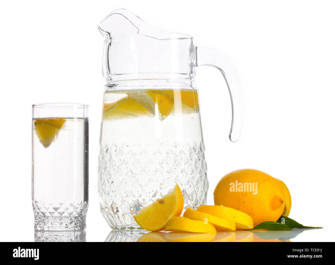 pitcher and glass of lemonade and lemon isolated on white Stock Photo ...