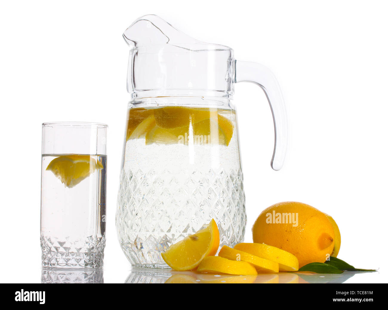 pitcher and glass of lemonade and lemon isolated on white Stock Photo ...