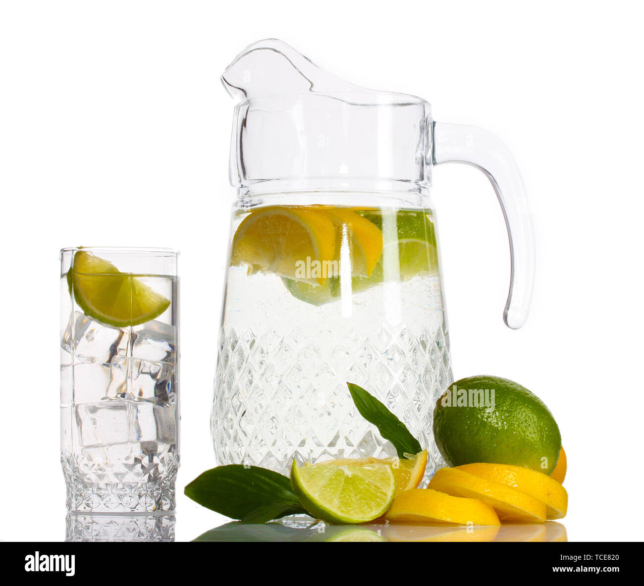 pitcher and glass of lemonade and lemon isolated on white Stock Photo ...