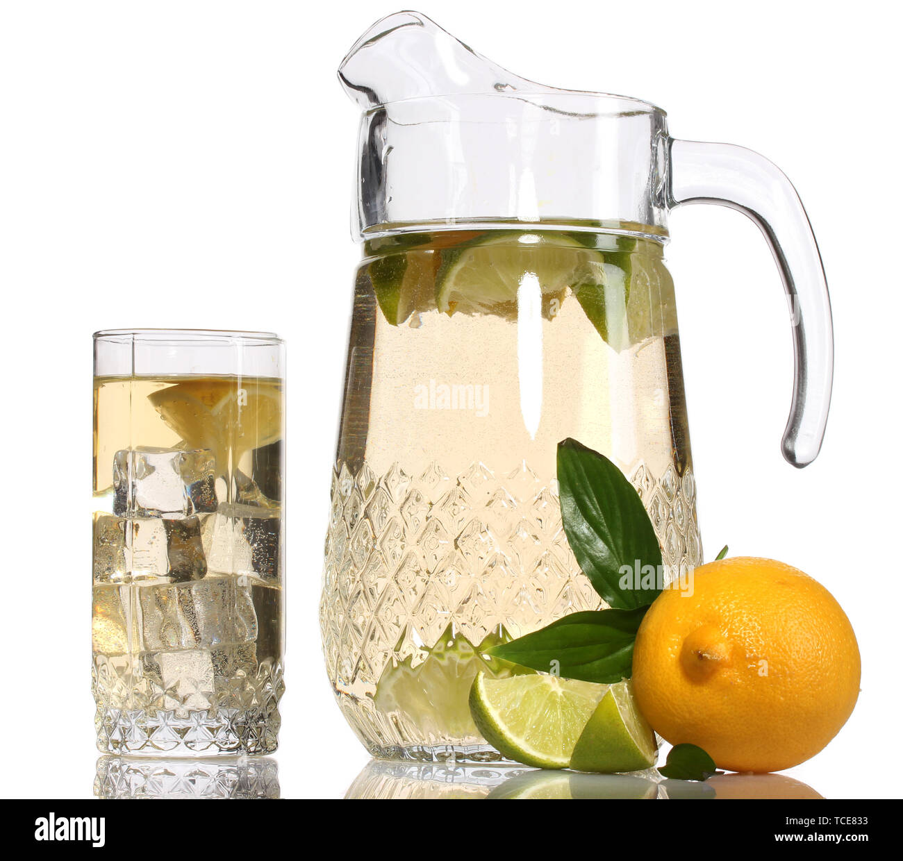 pitcher and glass of lemonade and lemon isolated on white Stock Photo ...