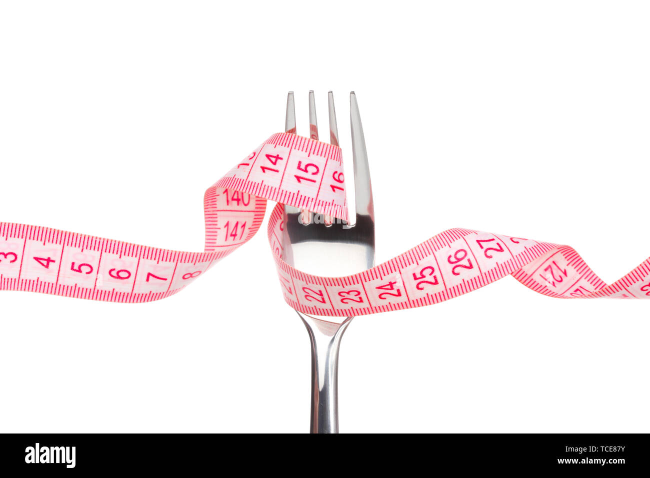 Fork and measuring tape isolated on white Stock Photo - Alamy