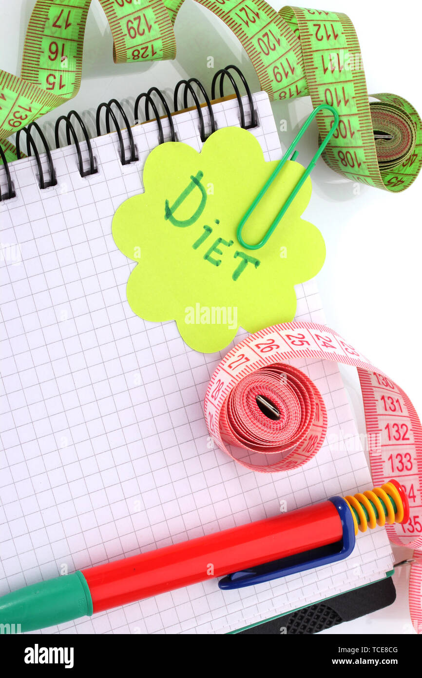 Planning of diet. Notebook measuring tapes and pen isolated on white ...