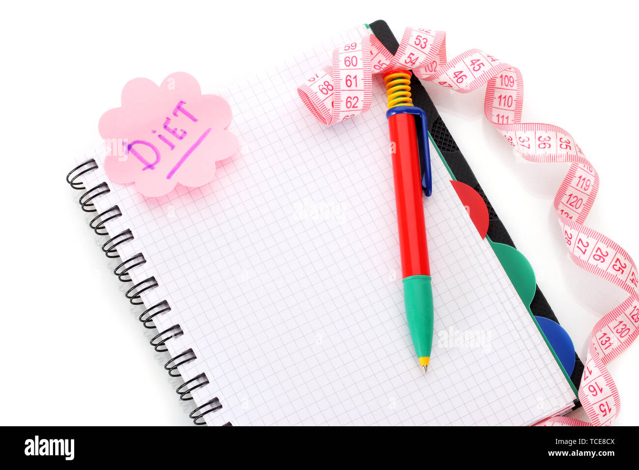 Planning of diet. Notebook measuring tape and pencil isolated on white ...