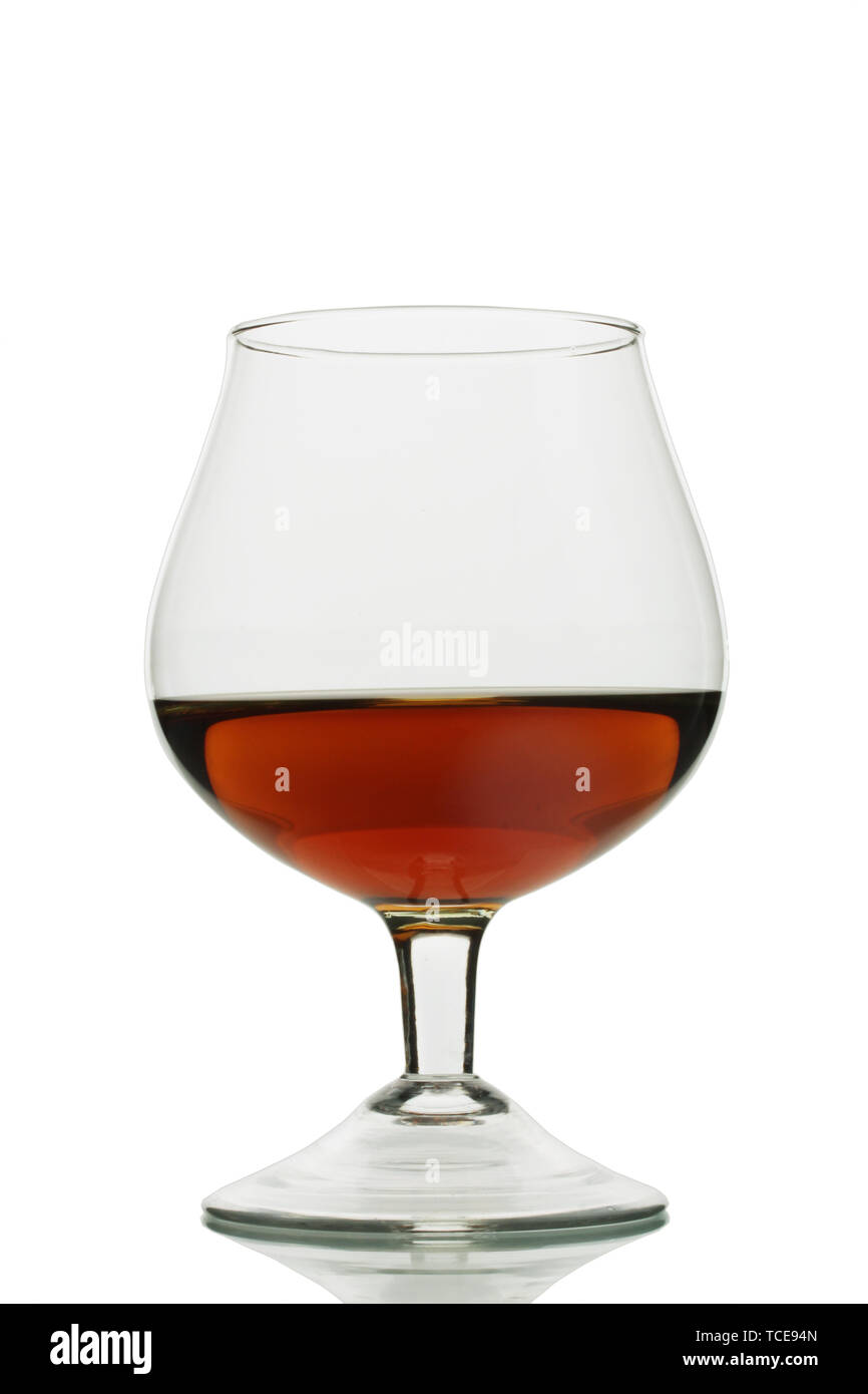 Glass of cognac isolated on white Stock Photo - Alamy