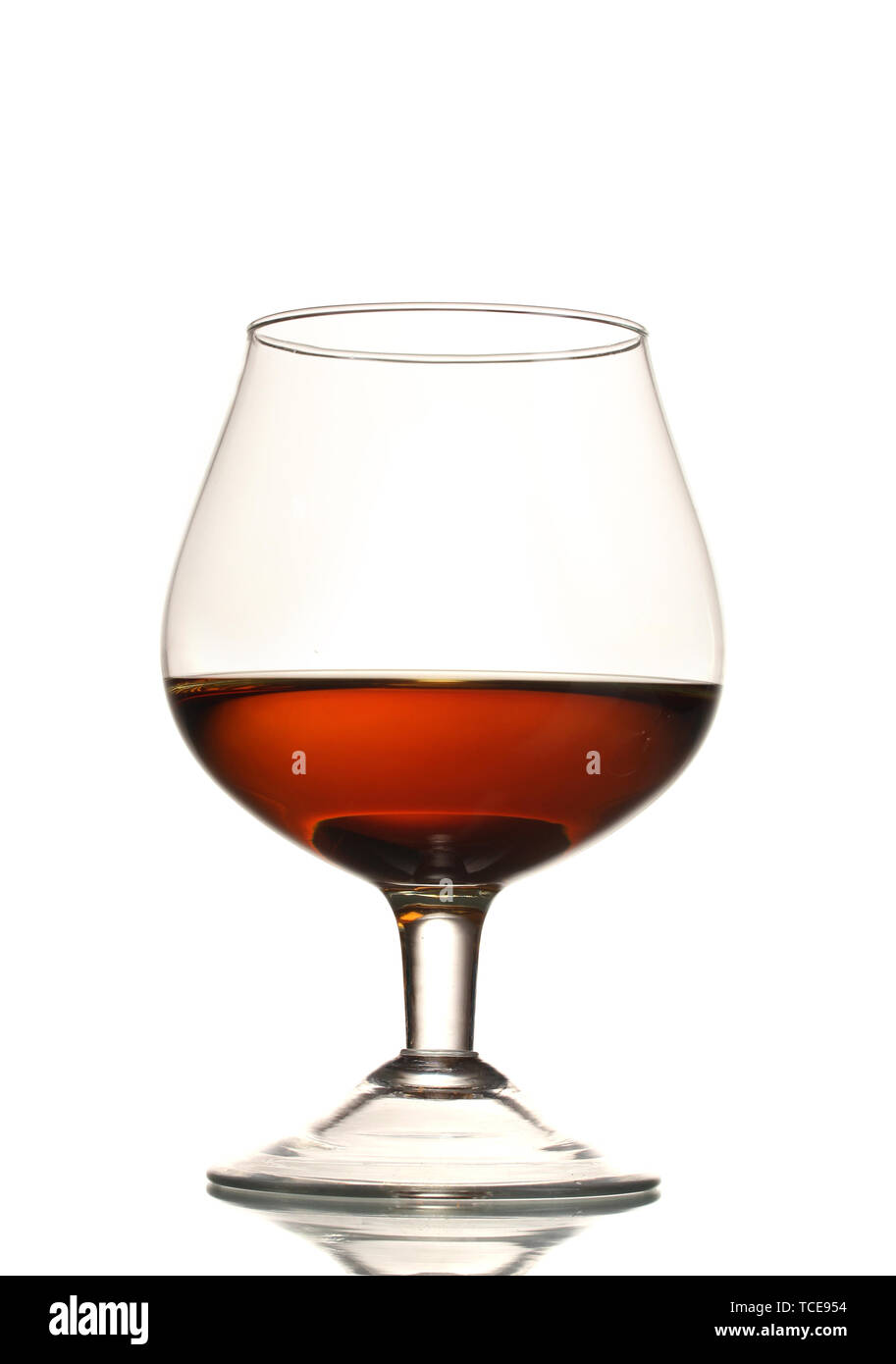 Glass of cognac isolated on white Stock Photo - Alamy