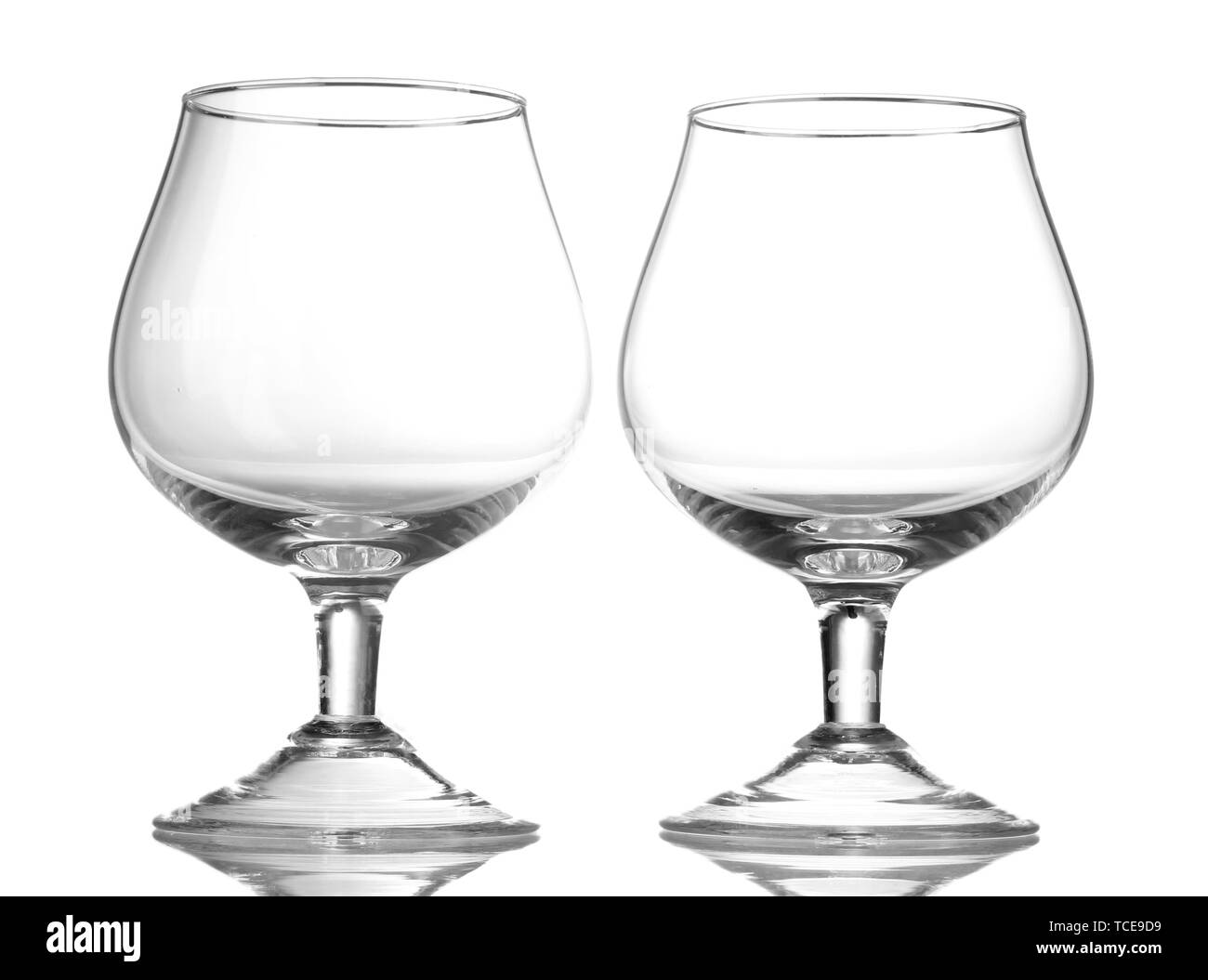 Two empty glasses isolated on white Stock Photo - Alamy