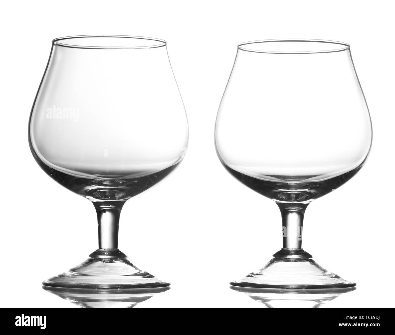 Two empty glasses isolated on white Stock Photo - Alamy