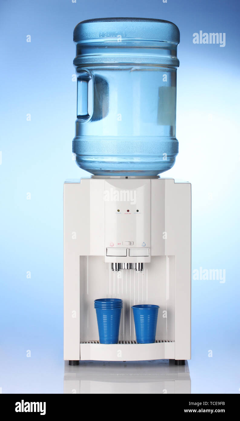 Electric water cooler on blue background Stock Photo - Alamy