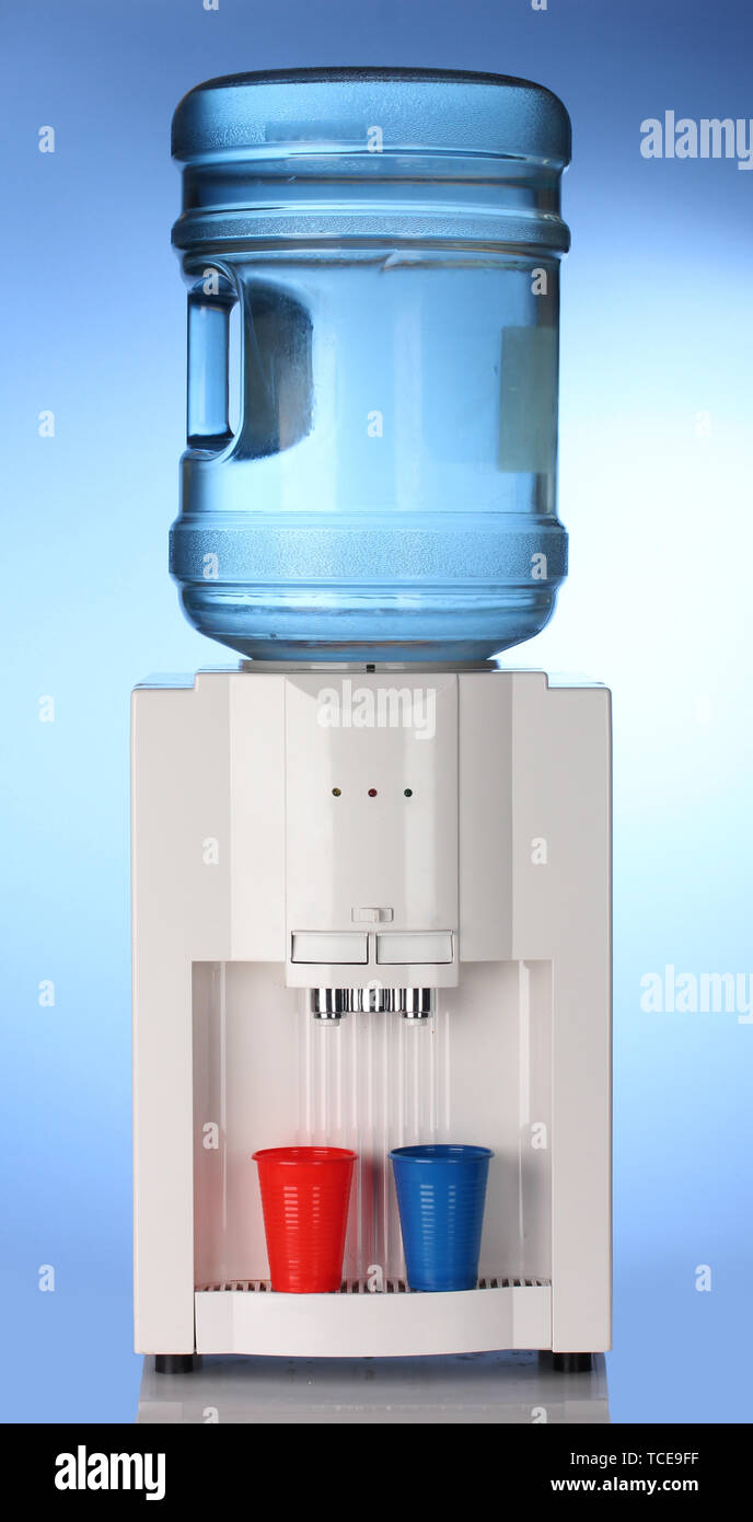 Electric water cooler on blue background Stock Photo - Alamy