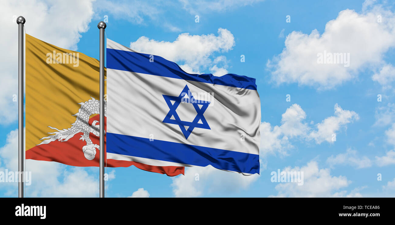 Bhutan and Israel flag waving in the wind against white cloudy blue sky ...