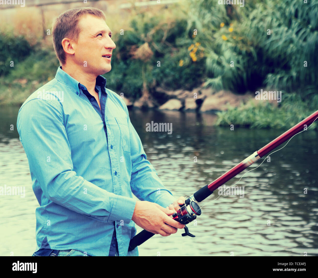 Happy smiling fisherman pulling hi-res stock photography and images - Alamy