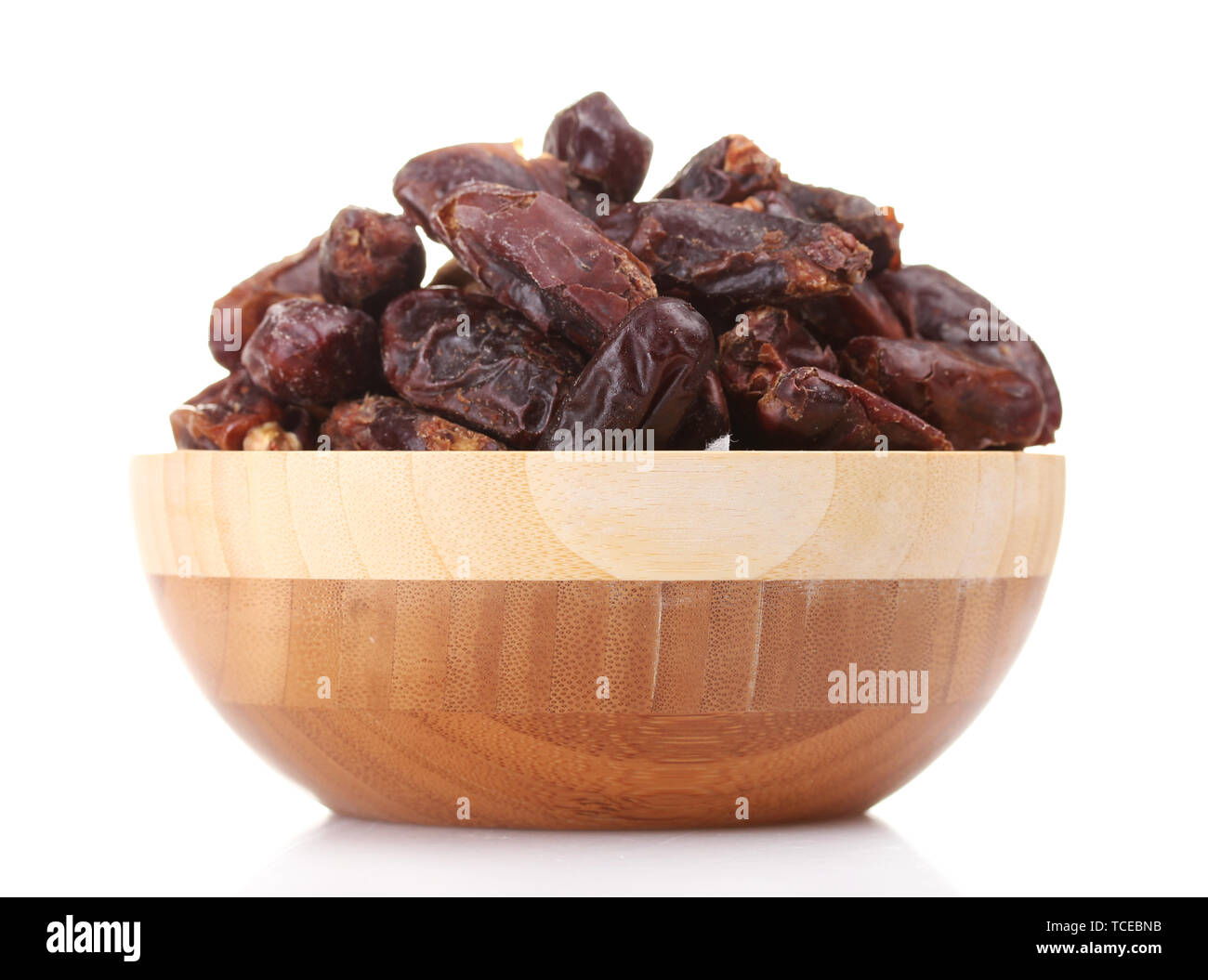 delicious dried dates in wooden bowl isolated on white Stock Photo - Alamy