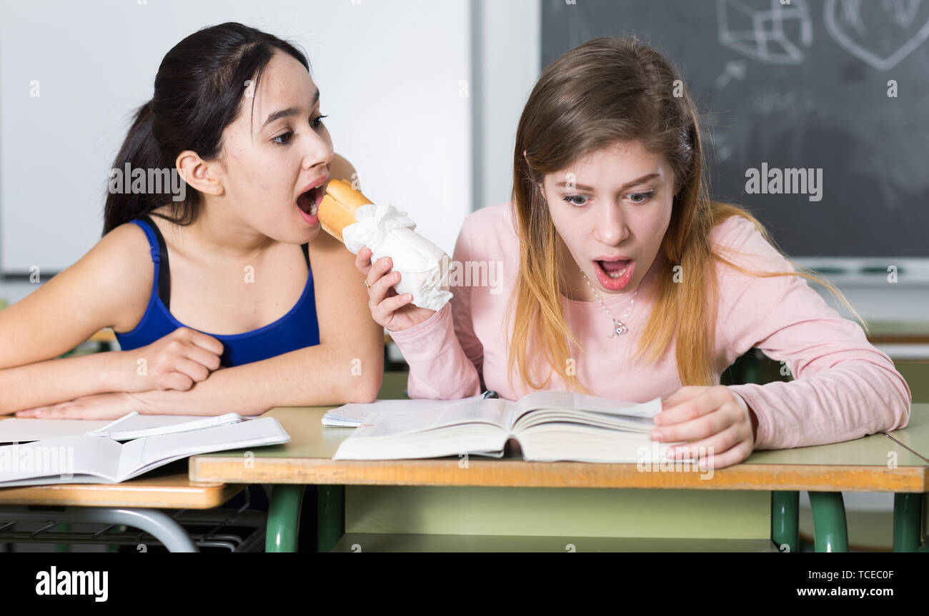 Girl homework eat desk hi-res stock photography and images - Alamy