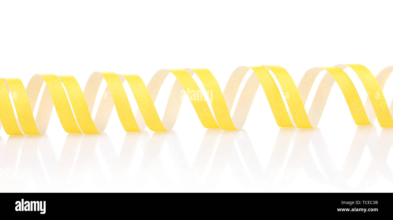 yellow streamer isolated on white Stock Photo - Alamy