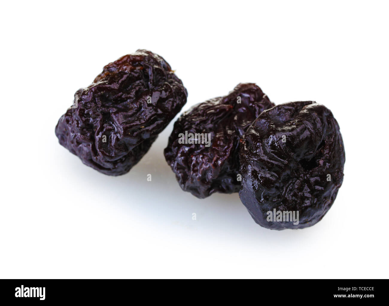 yummy dried plums isolated on white Stock Photo - Alamy