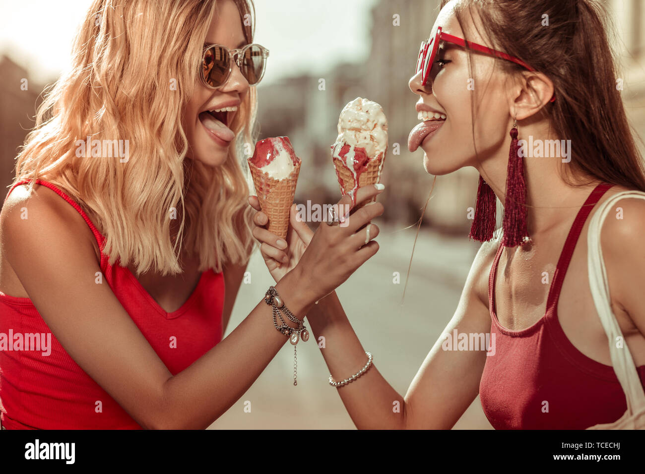 Women with ice-creams. Two beautiful alluring charming delightful young ...