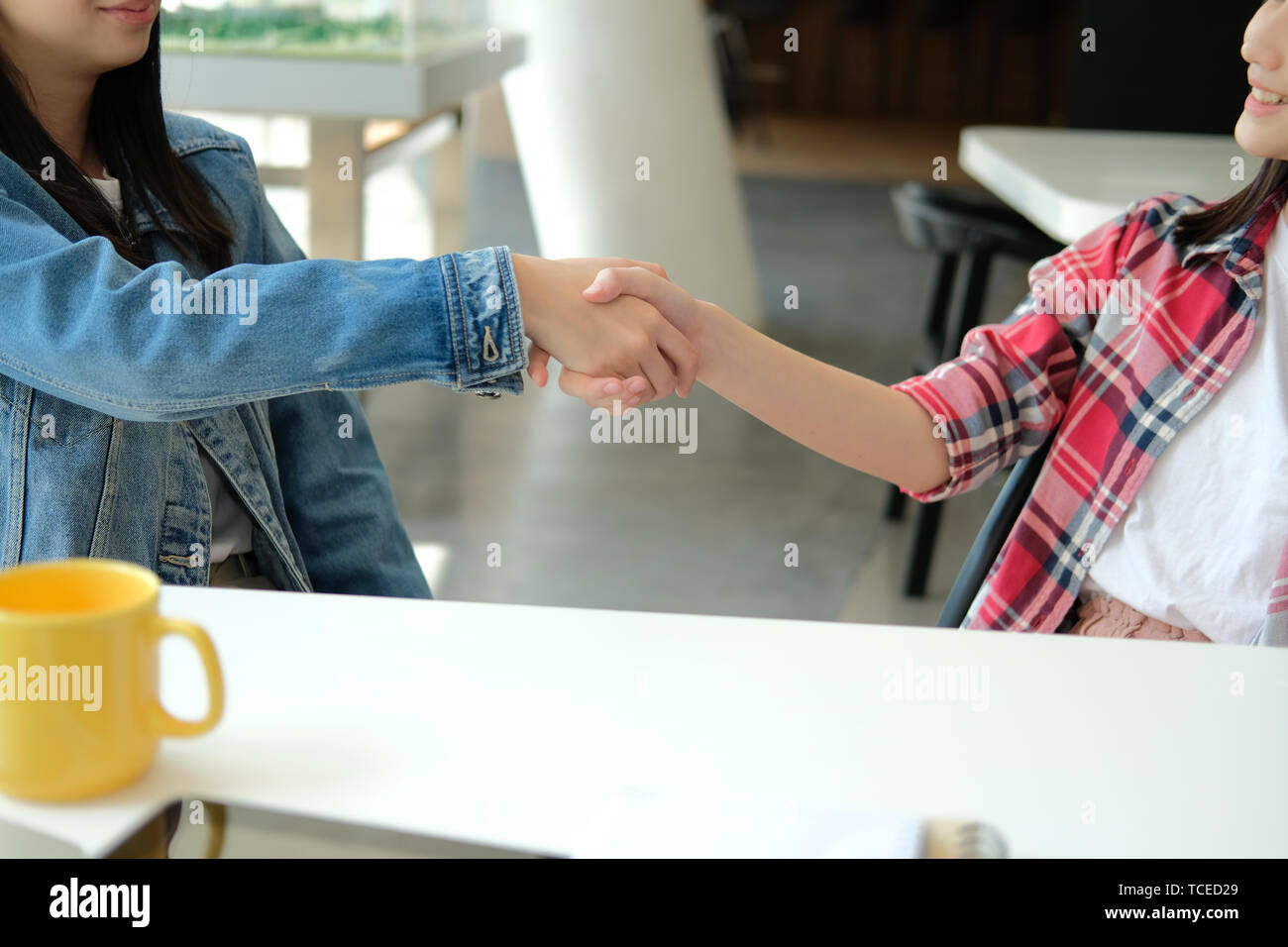Girls teenager handshake hi-res stock photography and images - Alamy