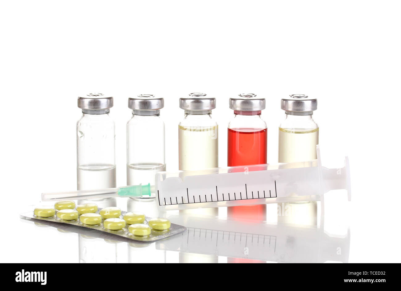 Syringe with medical ampoule and tablets isolated on white Stock Photo ...