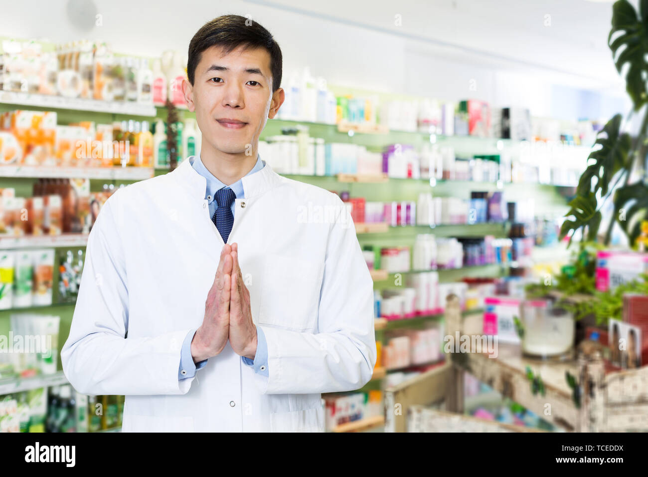 Happy japanese pharmacist standing hi-res stock photography and images ...