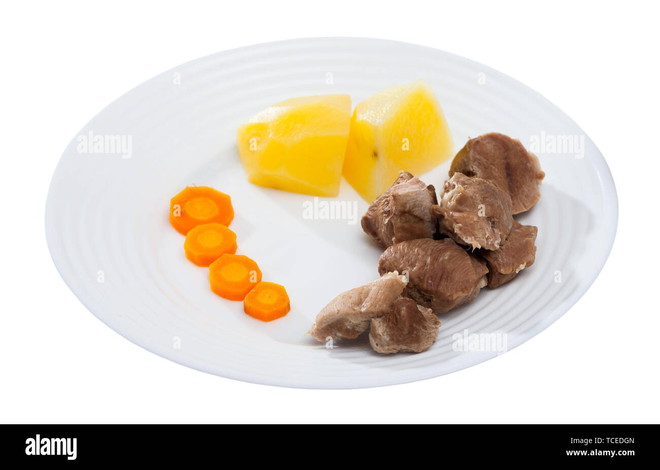 Close up of tasty steamed turkey with boiled potatoes and carrots, diet ...