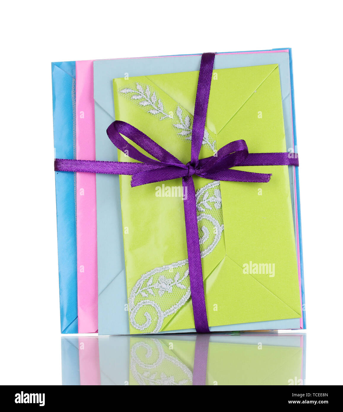 Bunch of color envelopes with ribbon isolated on white Stock Photo - Alamy