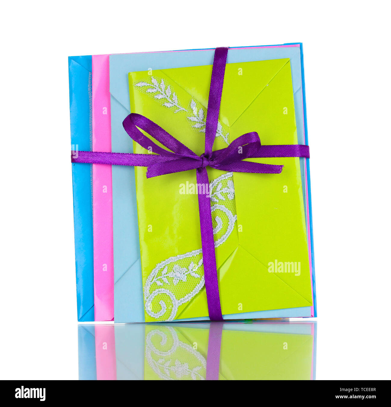 Bunch of color envelopes with ribbon isolated on white Stock Photo - Alamy