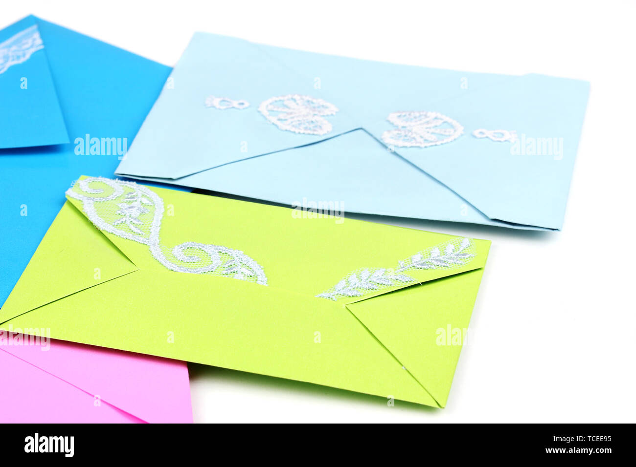 Bunch of color envelopes close-up isolated on white Stock Photo - Alamy