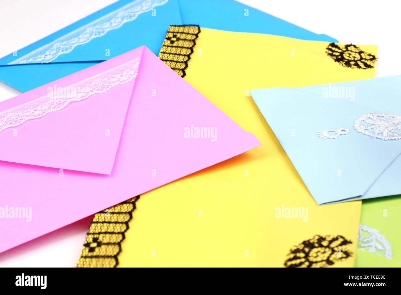 Bunch of color envelopes close-up isolated on white Stock Photo - Alamy