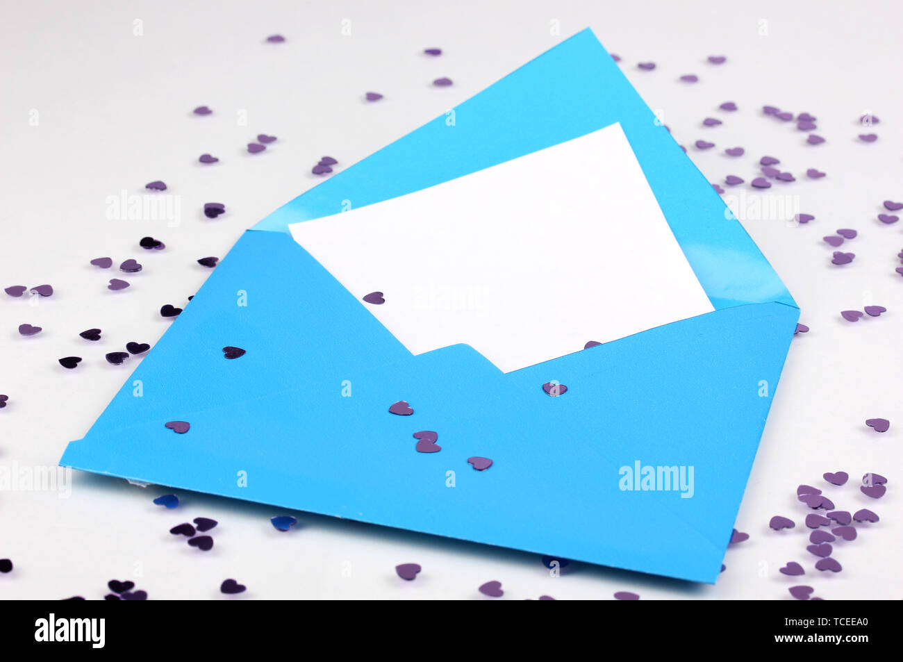 Color envelope and confetti isolated on white Stock Photo - Alamy
