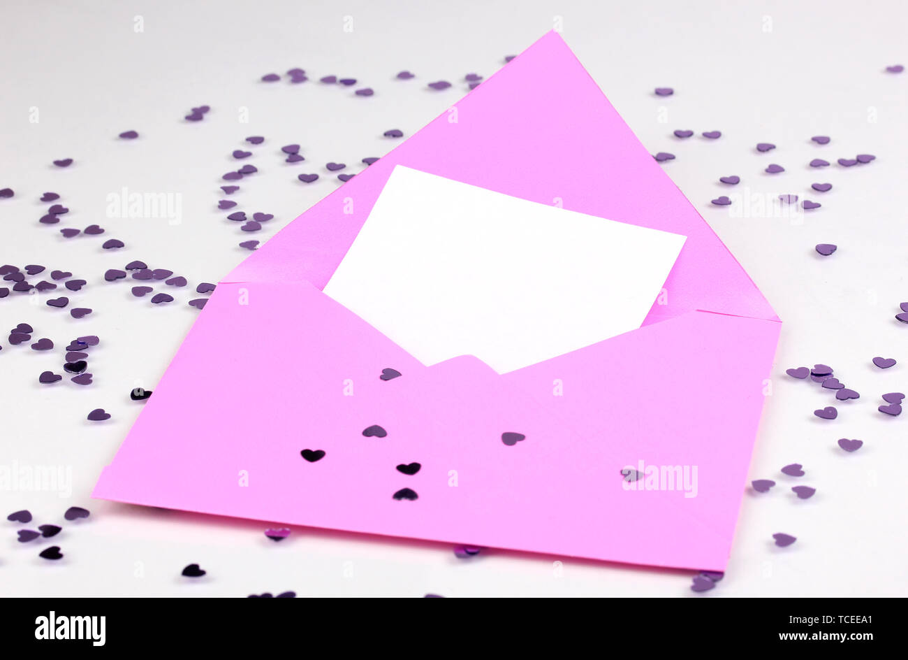 Color envelope and confetti isolated on white Stock Photo - Alamy