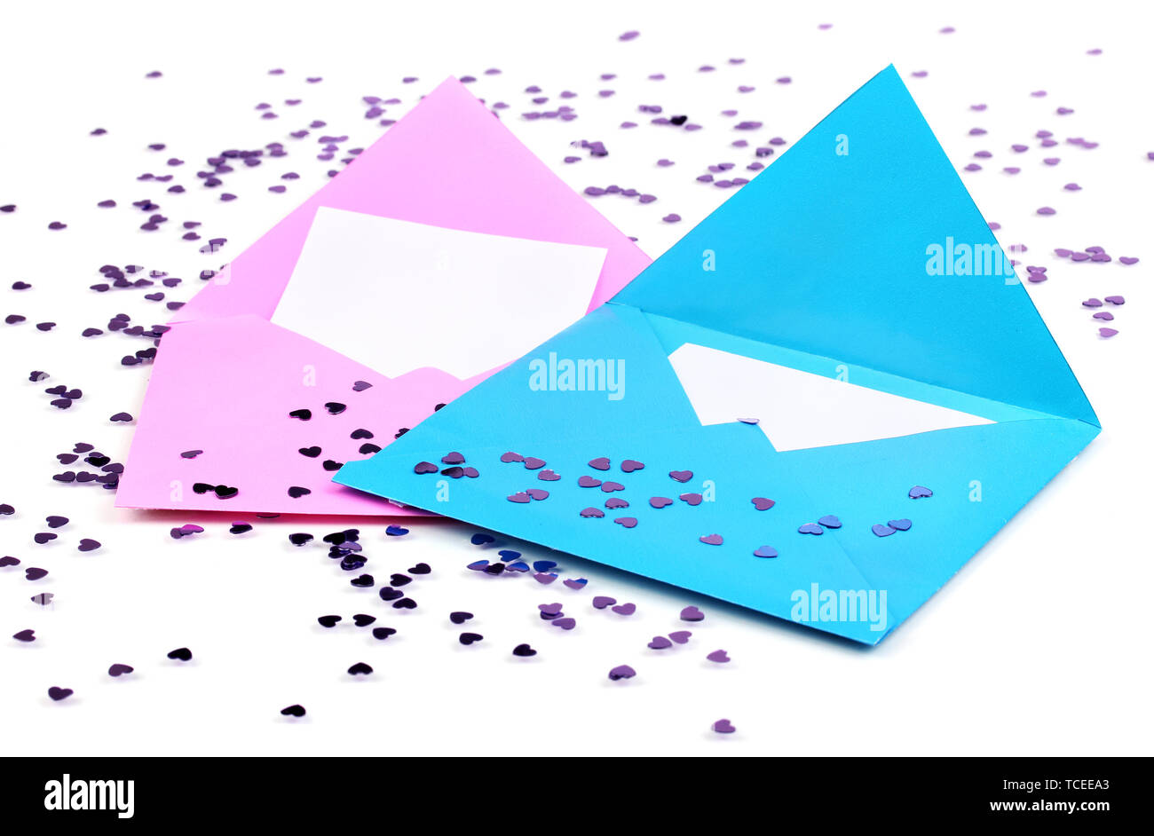 Color envelopes and confetti isolated on white Stock Photo - Alamy