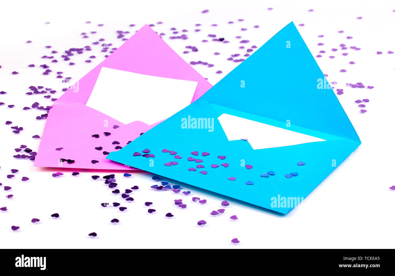 Color envelopes and confetti isolated on white Stock Photo - Alamy