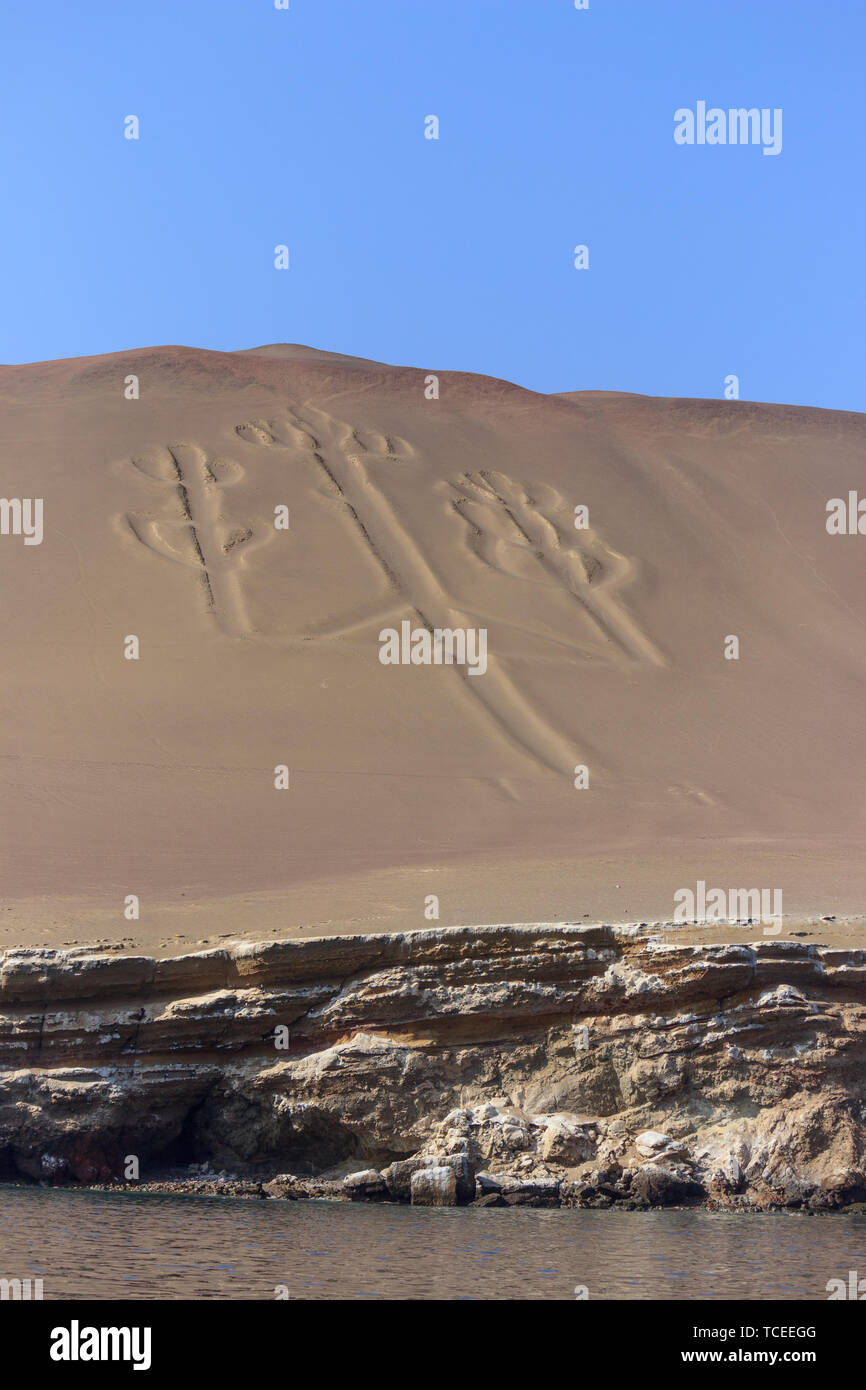ancient inca sign, candelabra, in the sand at the islas ballestas, peru ...