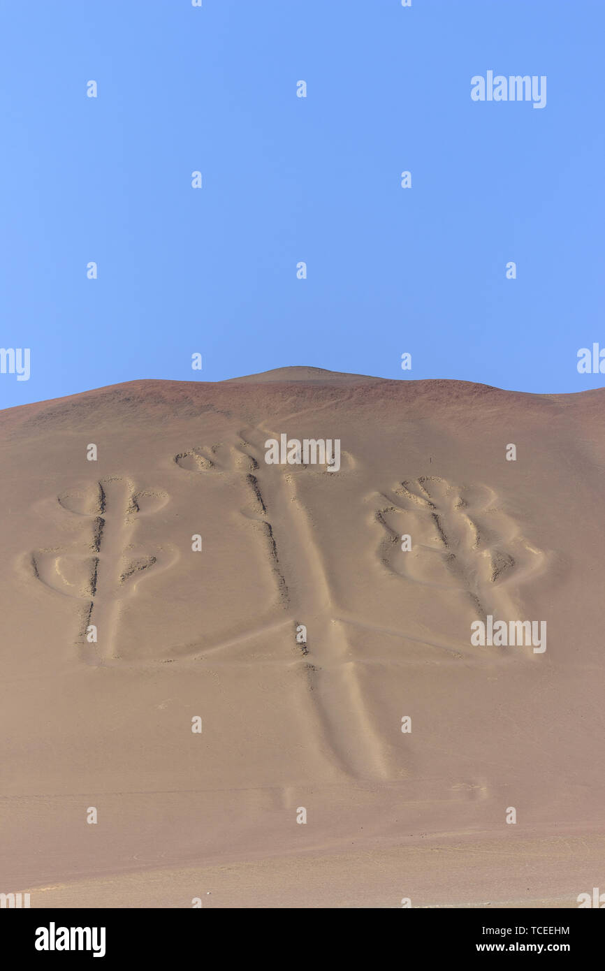 ancient inca sign, candelabra, in the sand at the islas ballestas, peru ...