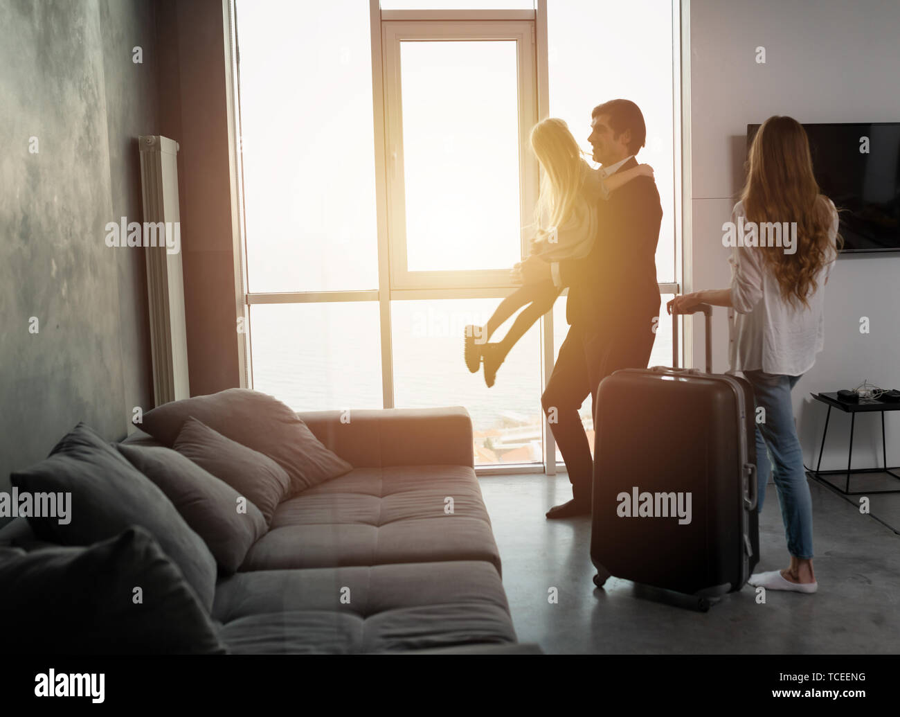 Father comes back to home from a travel Stock Photo - Alamy