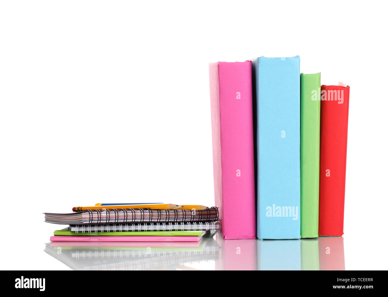 Books with stationery isolated on white Stock Photo - Alamy