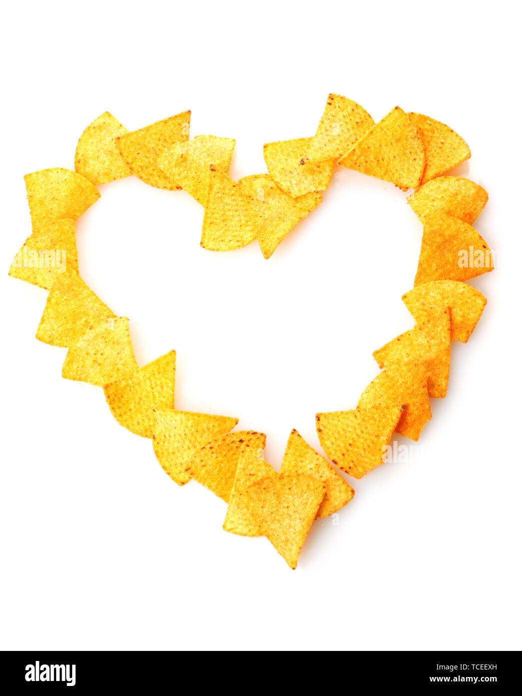 Delicious potato chips heart shape isolated on white Stock Photo - Alamy