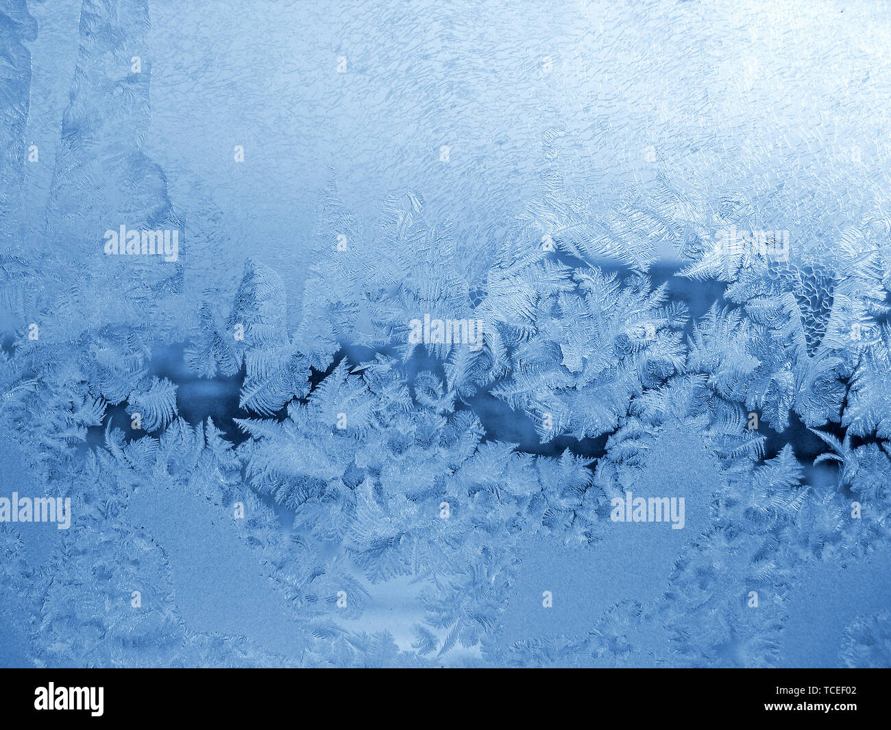 Natural ice pattern on winter window glass Stock Photo - Alamy
