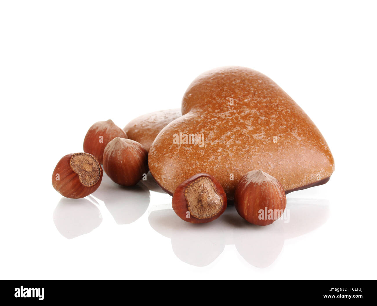 Heart-shaped cookies with hazelnuts isolated on white Stock Photo - Alamy