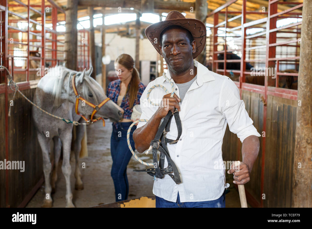 Couple working in stable hi-res stock photography and images - Alamy
