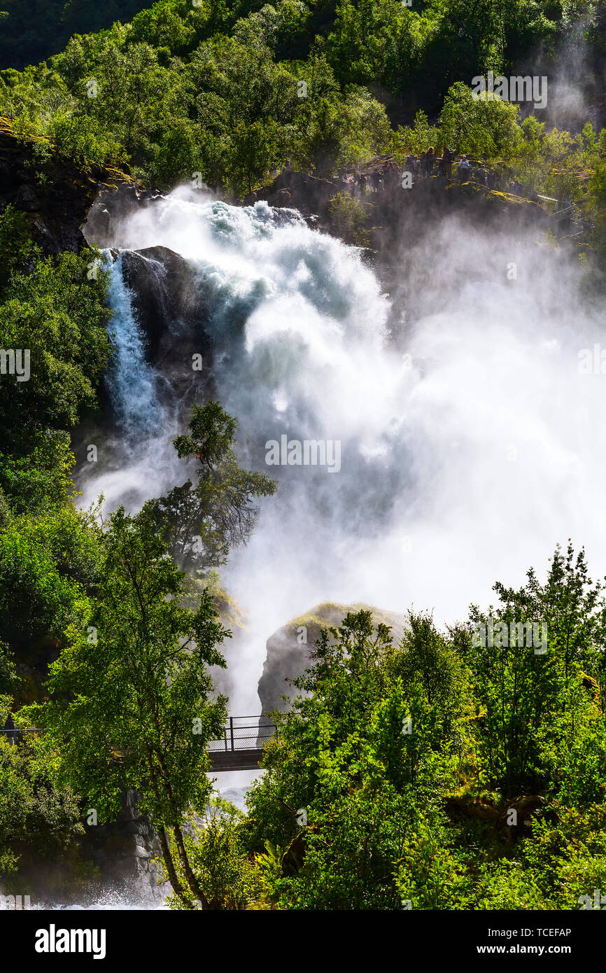 Waterfall Briksdal or Briksdalsbreen glacier in Olden, Norway and green ...