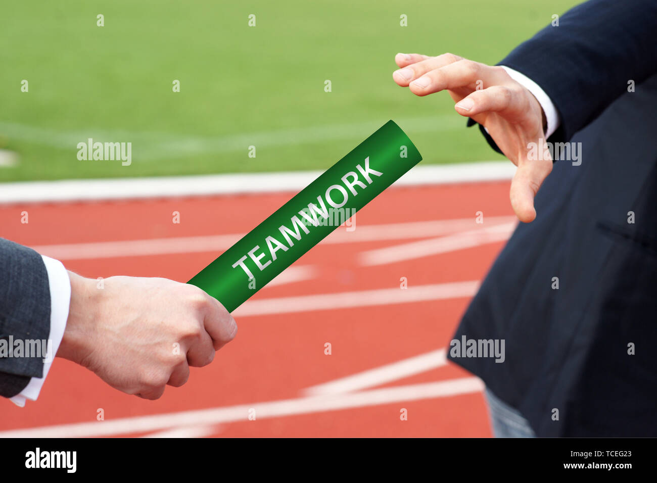 Teamwork - Cropped Hands of Businessman Passing Relay Baton Stock Photo ...