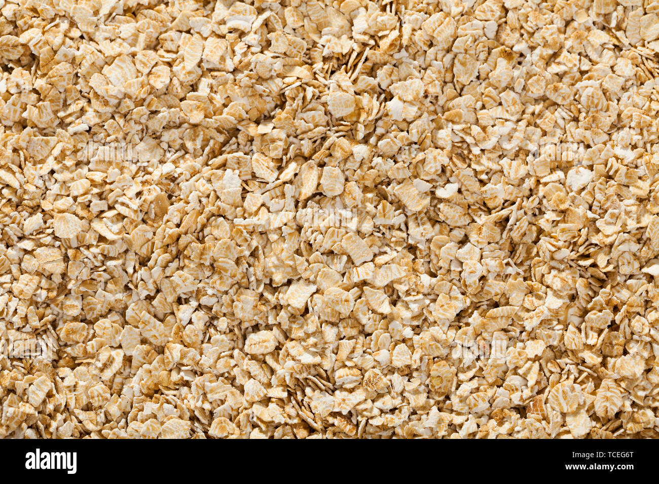 Diet food. Uncooked rolled oats as natural background Stock Photo - Alamy