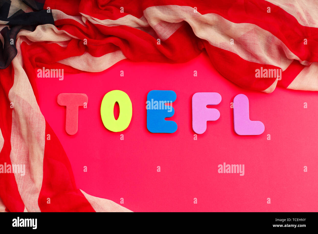 Word TOEFL and American flag on red background. USA exam. Speaking ...