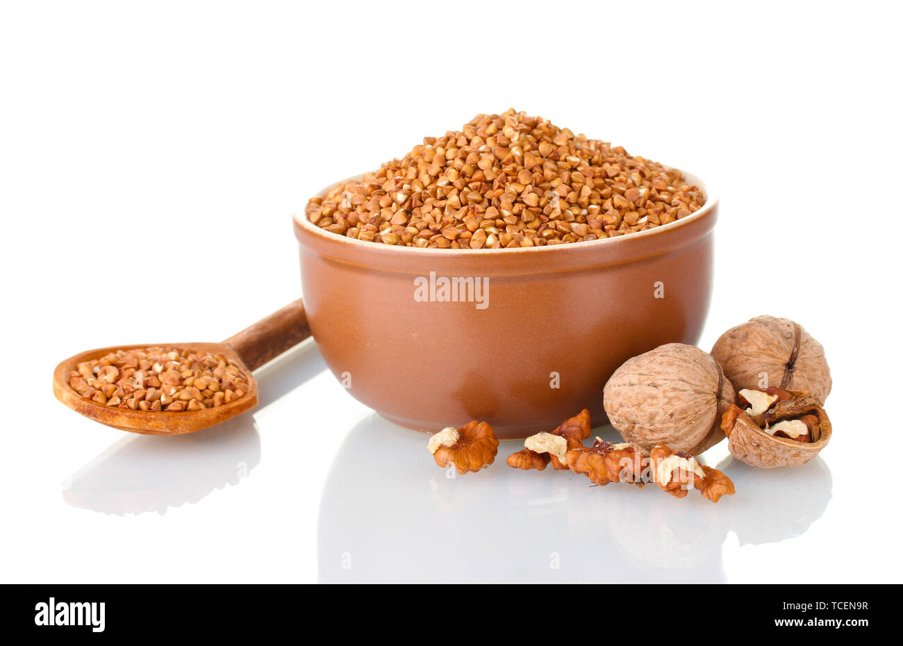 Raw buckwheat with nuts isolated on white Stock Photo - Alamy