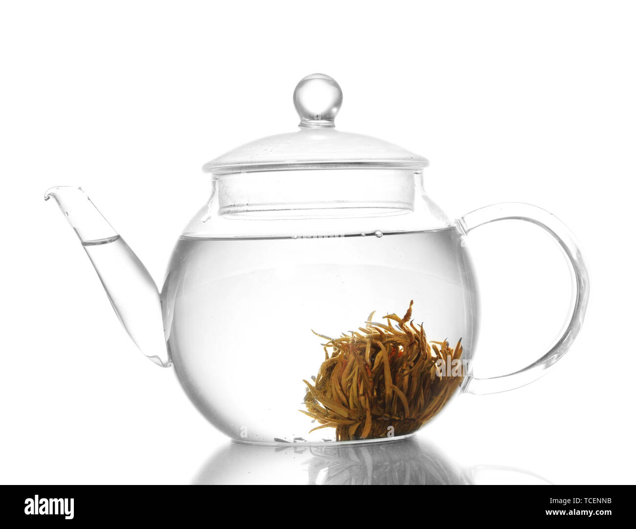 exotic green tea with flowers in glass teapot isolated on white Stock ...