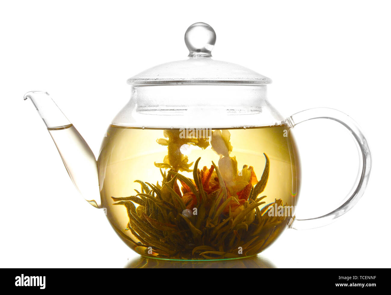 exotic green tea with flowers in glass teapot isolated on white Stock ...