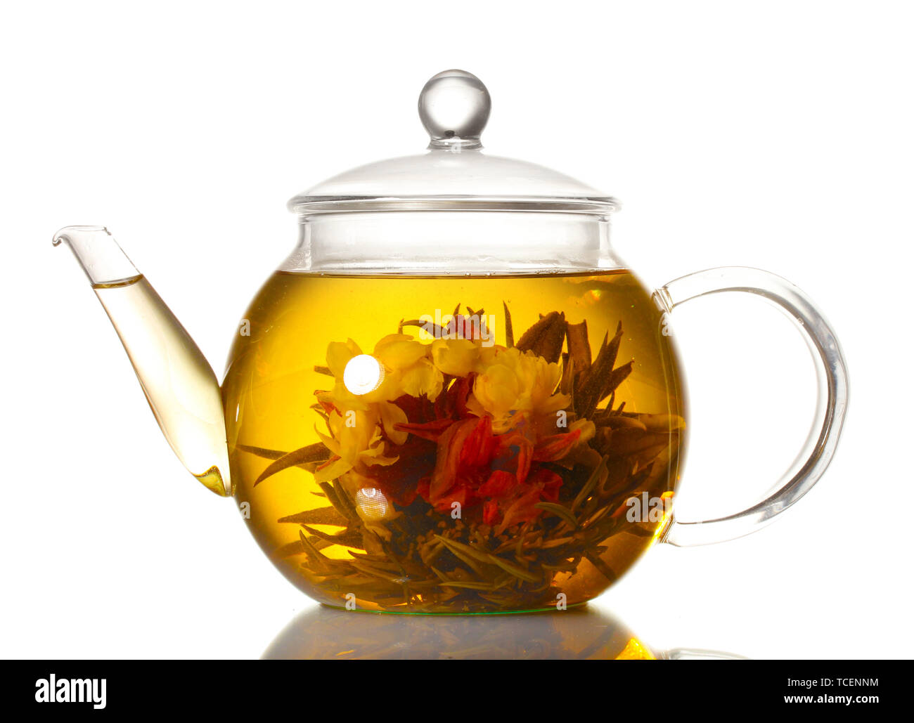 exotic green tea with flowers in glass teapot isolated on white Stock ...