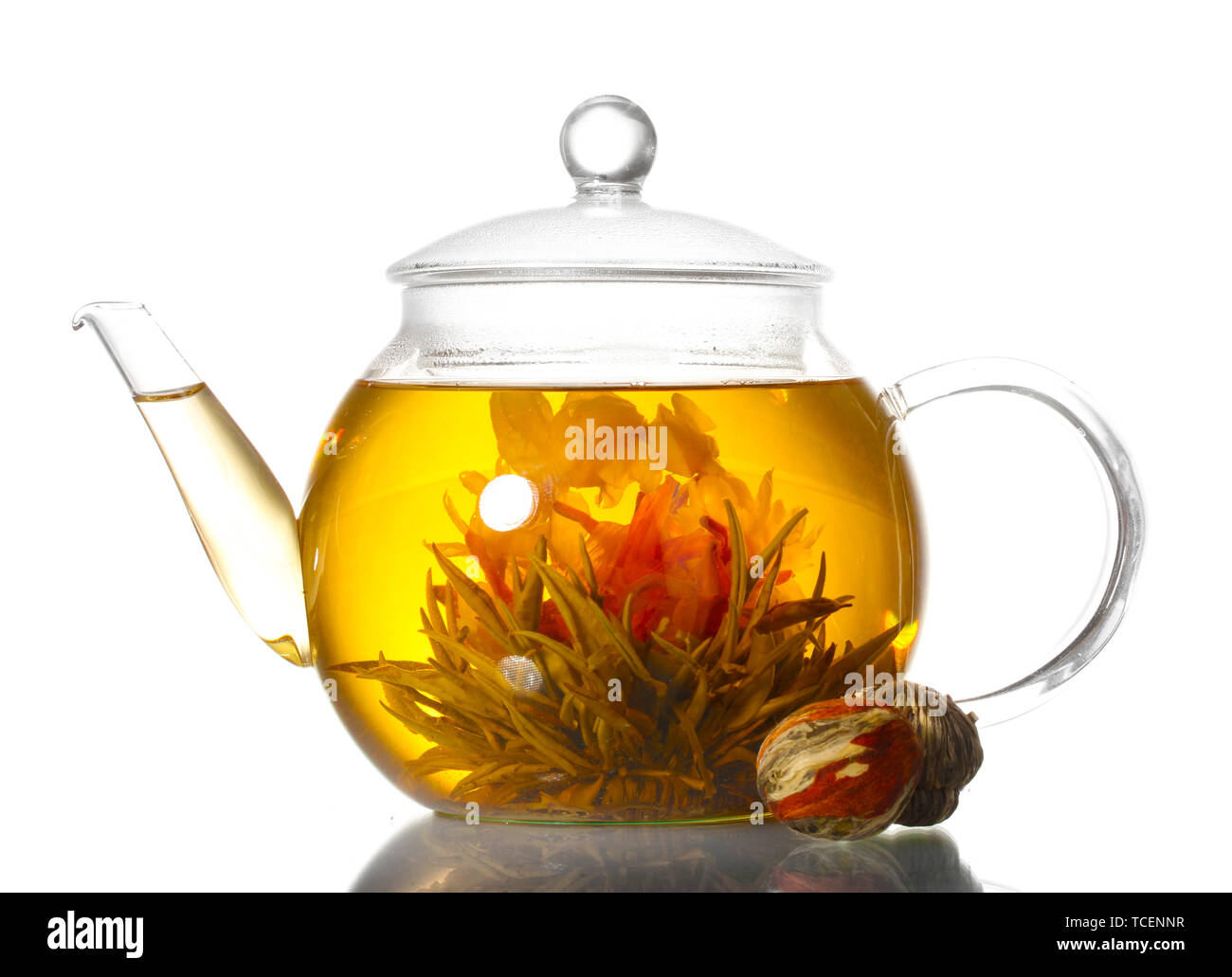 exotic green tea with flowers in glass teapot isolated on white Stock ...